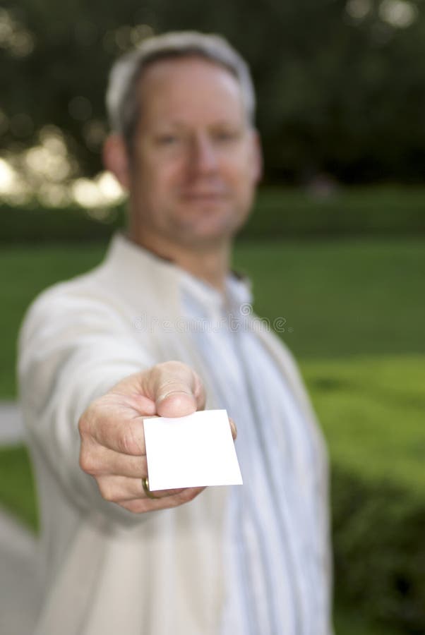 Young Man Giving A Blank Business Card Picture. Image: 6300967