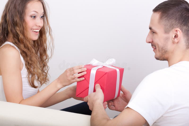 Young Man Giving Box for His Girlfriend Stock Photo - Image of ...