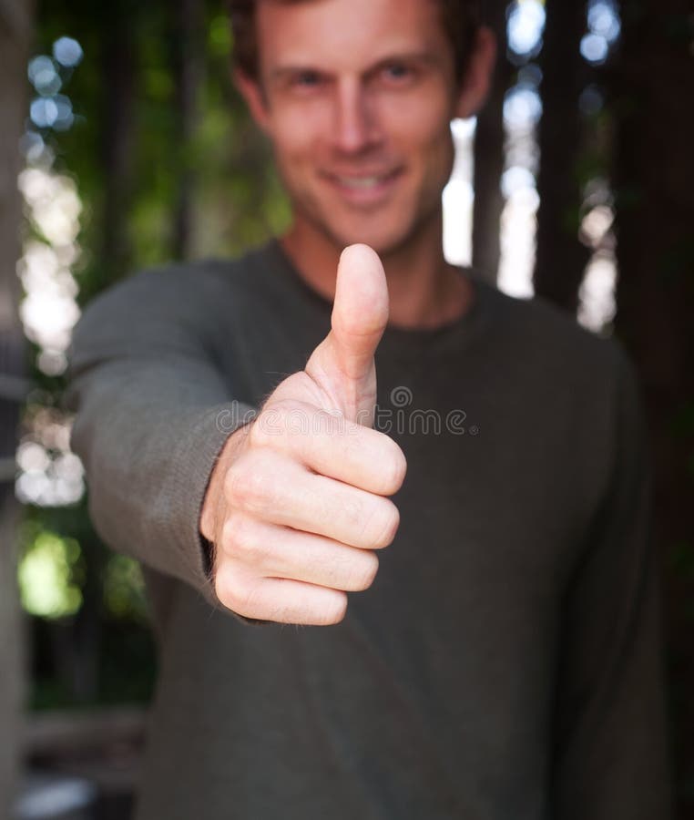 Young Man Giving a Thumbs Up Hand Gesture Stock Photo - Image of young ...