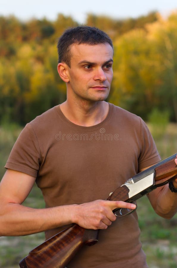 A young man with a gun stock photo. Image of lifestyle - 26386294