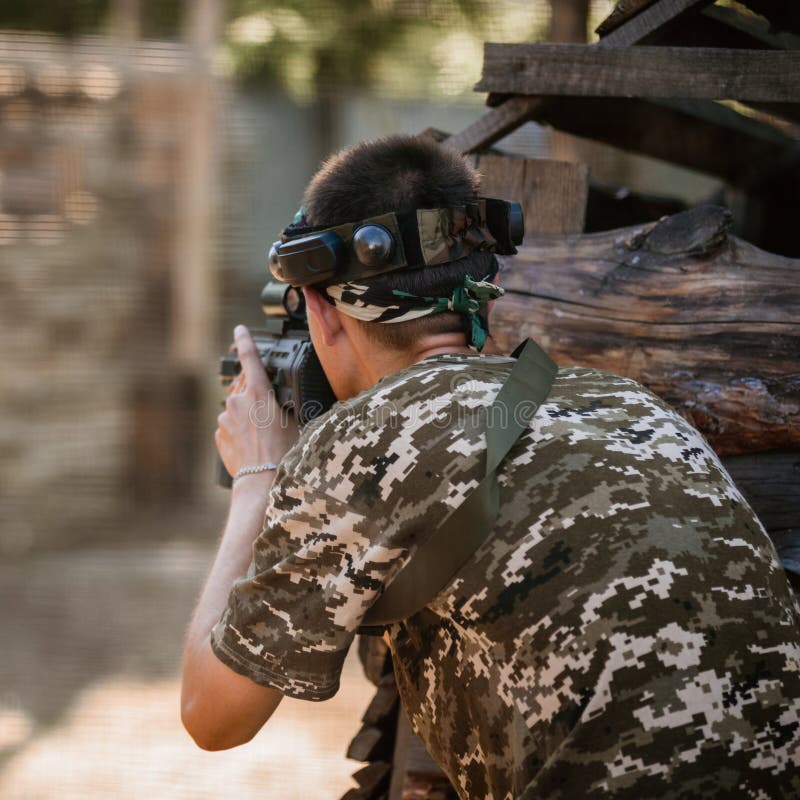 Lasertag player in forest editorial photography. Image of position ...