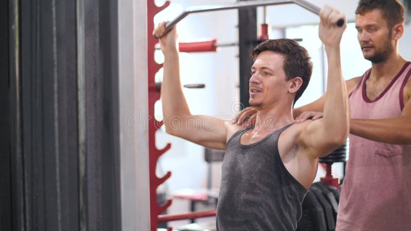 Young Man Gym Begginner Doing Pull Down Exercise in the Gym Using Lat ...