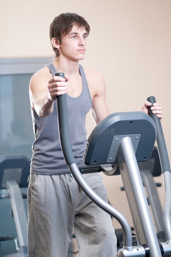 Young Man at the Gym Exercising. Running Stock Image - Image of cute ...