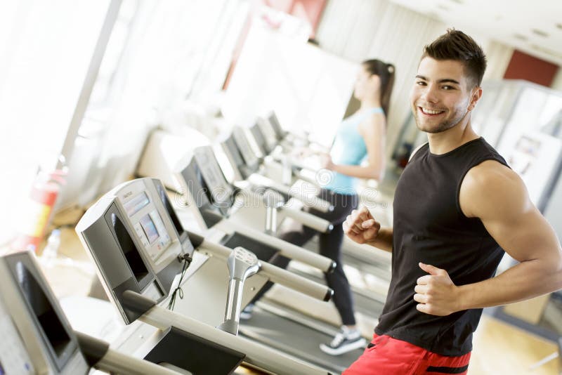 Young man in the gym stock photo. Image of practicing - 34065222