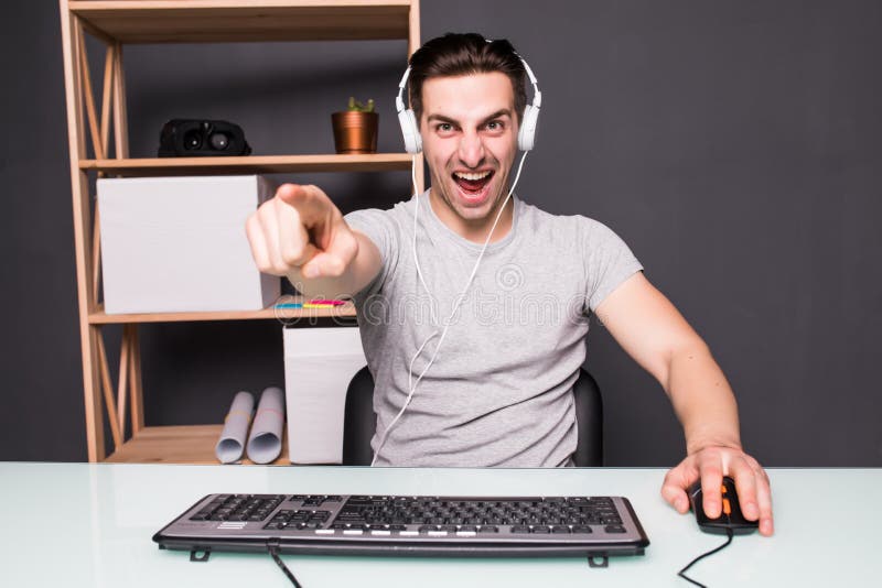 Young Man or Hacker in Headset and Eyeglasses with Pc Computer Playing ...