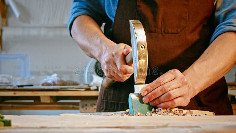 Young Man with a Hammer at Work in Studio Stock Photo - Image of ...