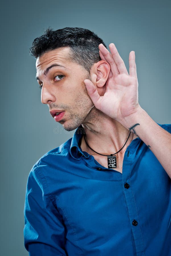 Young Man with a Hand in the Ear Stock Photo - Image of freshness ...