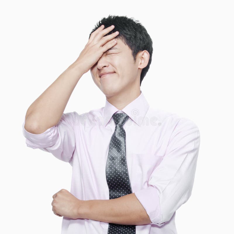 Young Man with Hand on Forehead, Studio Shot Stock Image - Image of ...