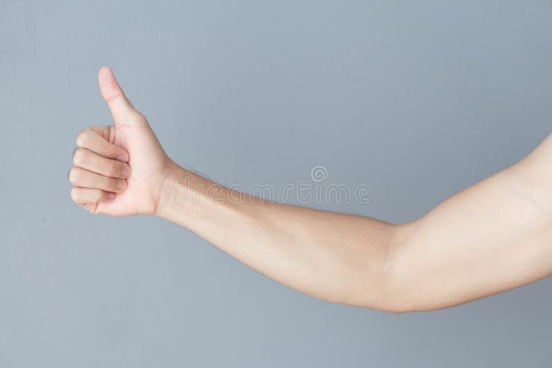 Young Man Hand Thumbs Up for Good Feeling with Grey Background Stock ...