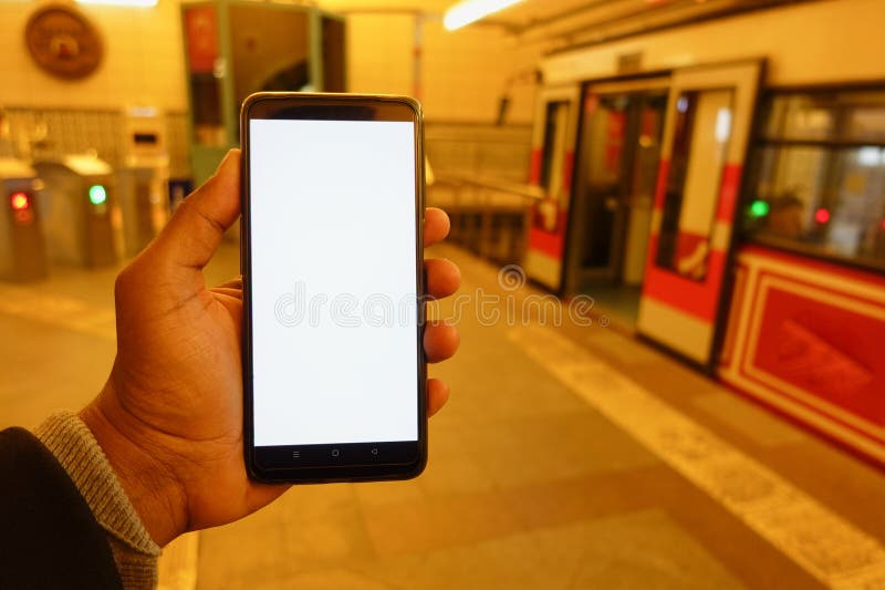 Young Man Hand Using Smart Phone with White Screen Inside of Metro ...