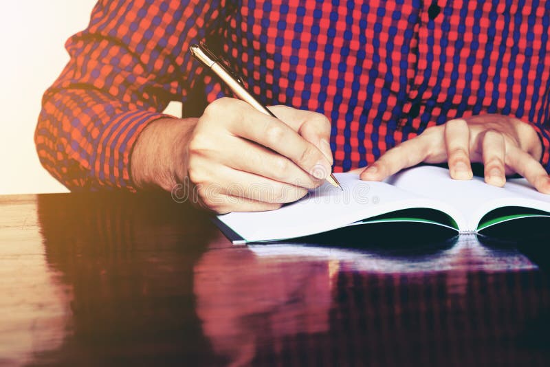 Young Man Hand Writing on Notebook with Pen. Stock Image - Image of ...