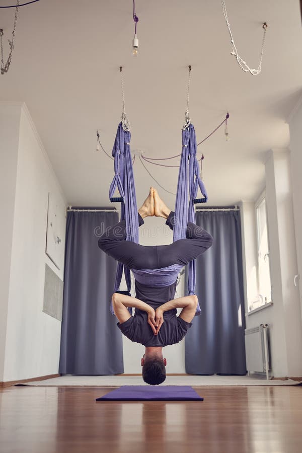 Young Man Hanging Upside Down and Doing Prayer Pose Stock Image - Image ...