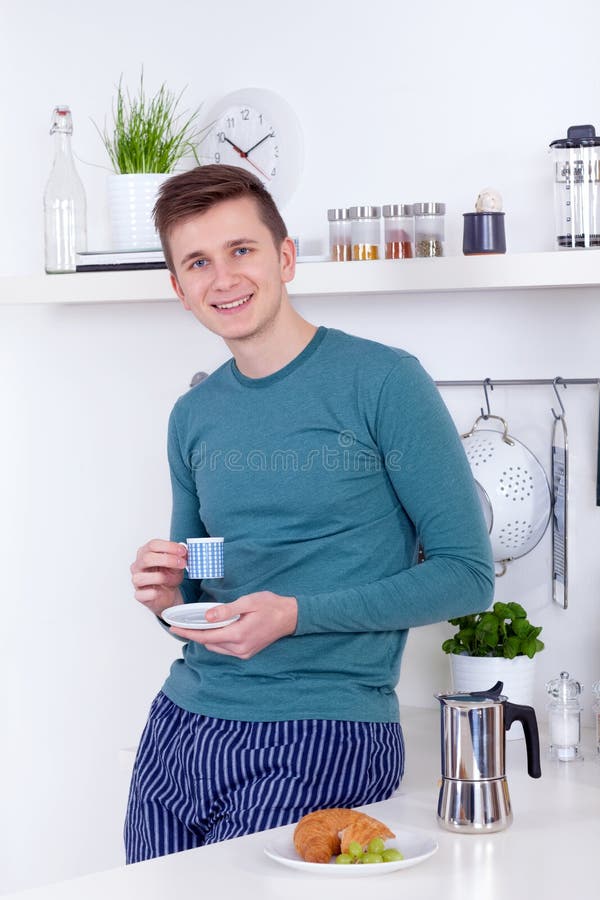 Young Man Having Breakfast in His Kitchen Stock Image - Image of modern ...