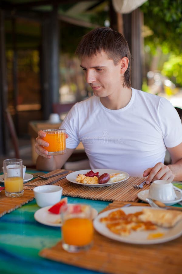 Young Man Having Breakfast at Outdoor Cafe Stock Image - Image of life ...