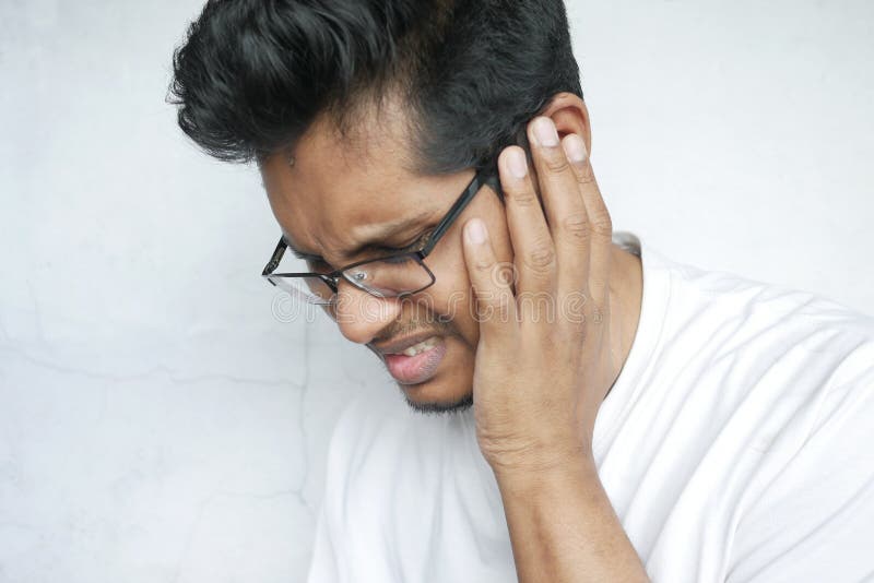 Young Man Having Ear Pain Touching His Painful Ear , Stock Image ...