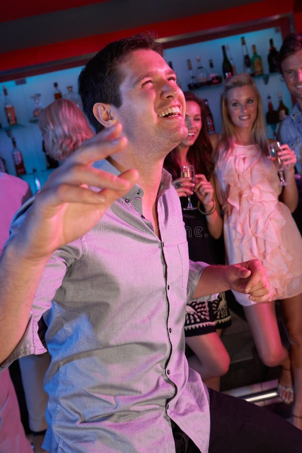Young Man Having Fun in Busy Bar Stock Photo - Image of enjoying ...