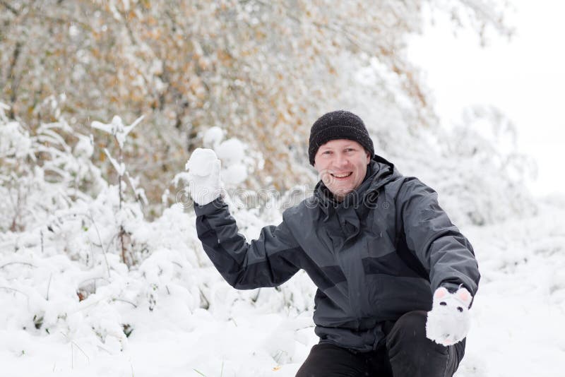 Young Man Having Fun with Snow Stock Photo - Image of casual, smiling ...