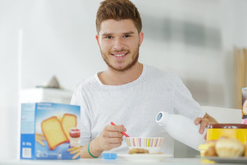 Young Man Having Healthy Breakfast in Modern Kitchen Stock Image ...