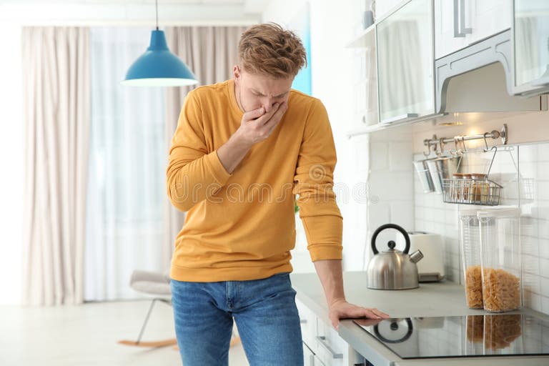 Young Man Having Nausea in Kitchen. Stock Photo - Image of kitchen ...