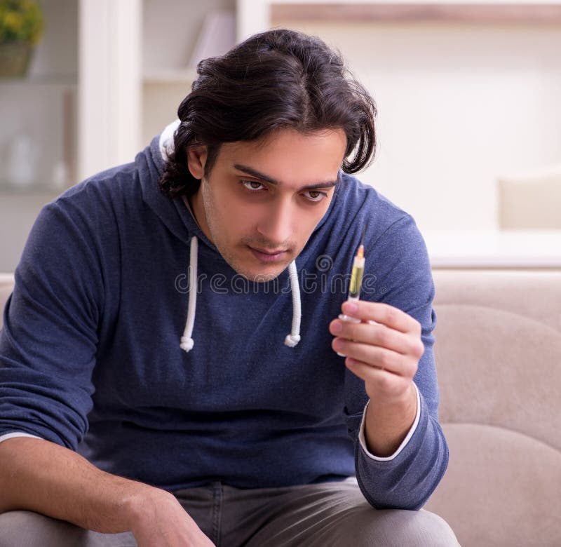 Young Man Having Problems with Narcotics at Home Stock Photo - Image of ...