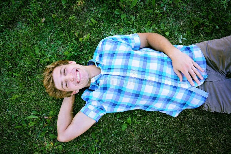 Young man is having a rest stock photo. Image of laying - 58061512