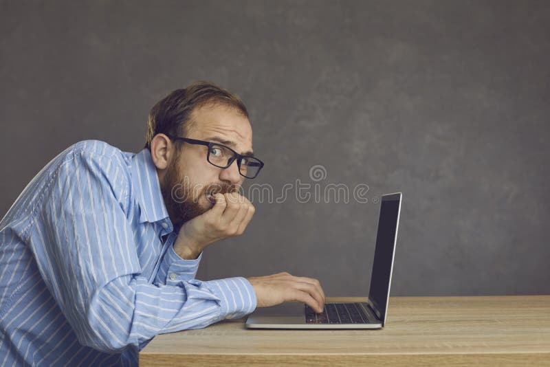 Scared Stressed Man Who Has Made a Mistake Biting Nails Sitting at ...