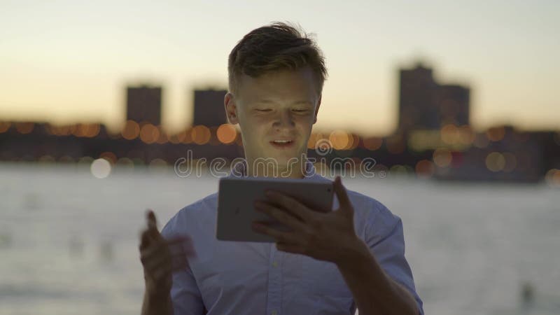 Young Man Having a Video Call on Mobile Tablet Screen Talking Stock ...
