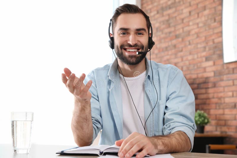 Young Man with Headset Looking at Camera and Using Video Chat Stock ...