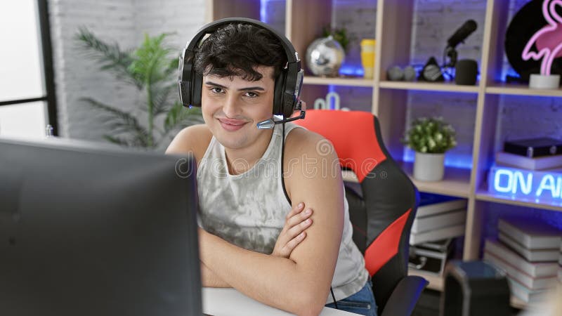 Young Man with Headset in Modern Gaming Room Leaning on Desk Smiling ...