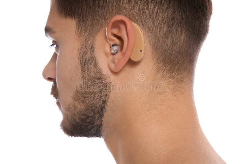 Young man with hearing aid stock photo. Image of isolated - 137977294