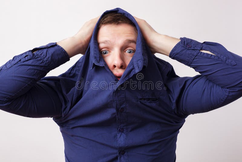 Young Man Hiding in a Blue Shirt Hiding His Face Stock Image - Image of ...