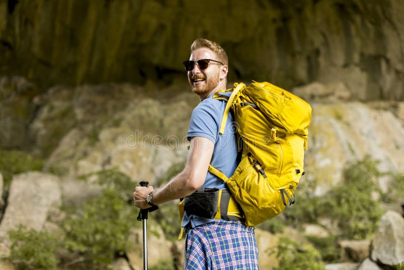 Young man hiking stock photo. Image of countryside, healthy - 76855314