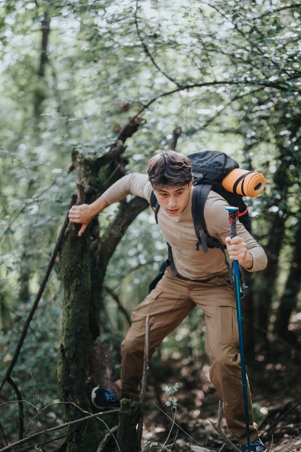 Young Man Hiking through Dense Forest, Navigating Rugged Terrain with ...