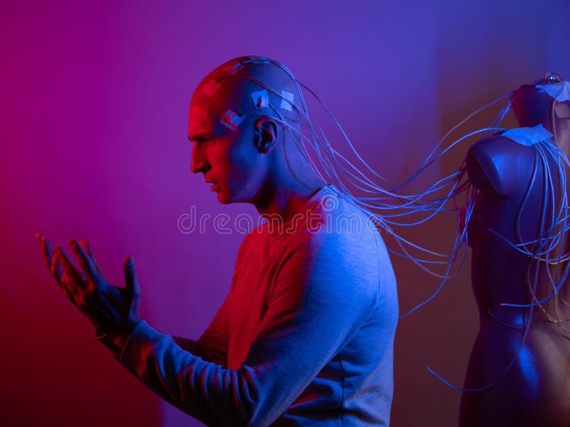 A Young Man with His Head Entangled in Wires is Trying To Pull Out ...