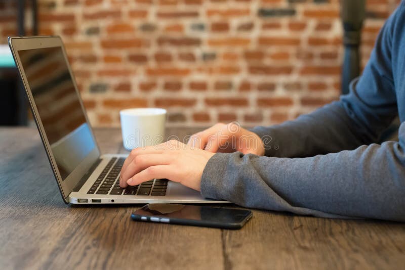 Young Man with His Laptop in the Room. Searching the Web Stock Photo ...
