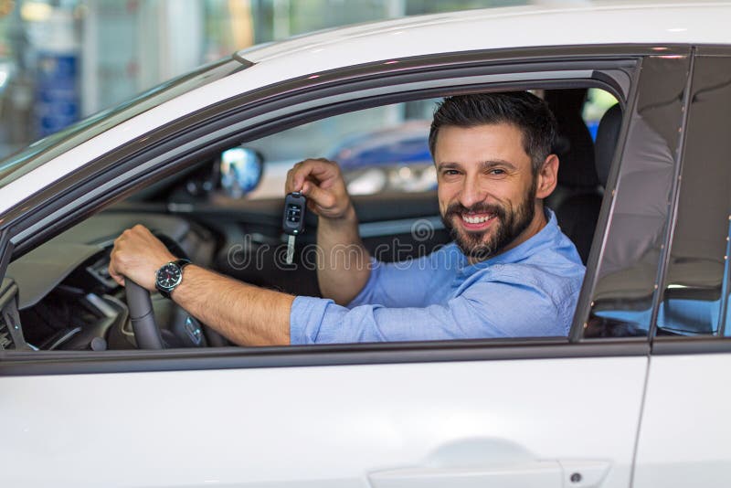 Young man with his new car stock photo. Image of customer - 94458178