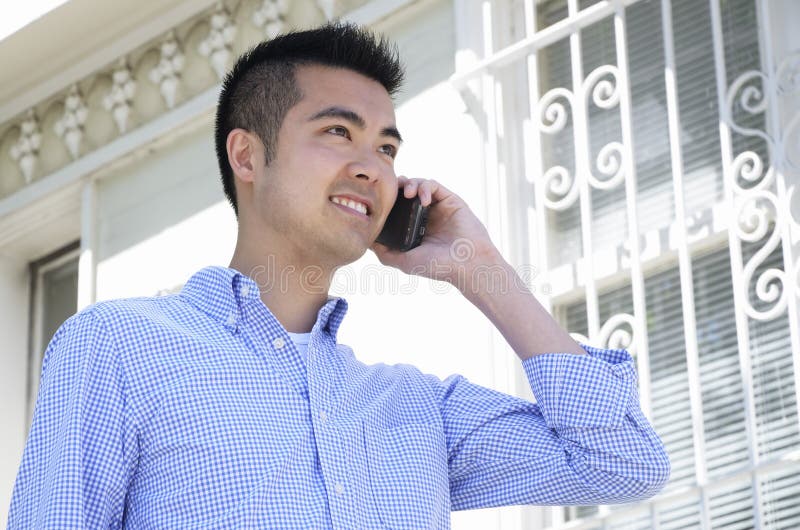 Young Man on His Phone Outdoors Stock Photo - Image of chinese, outdoor ...