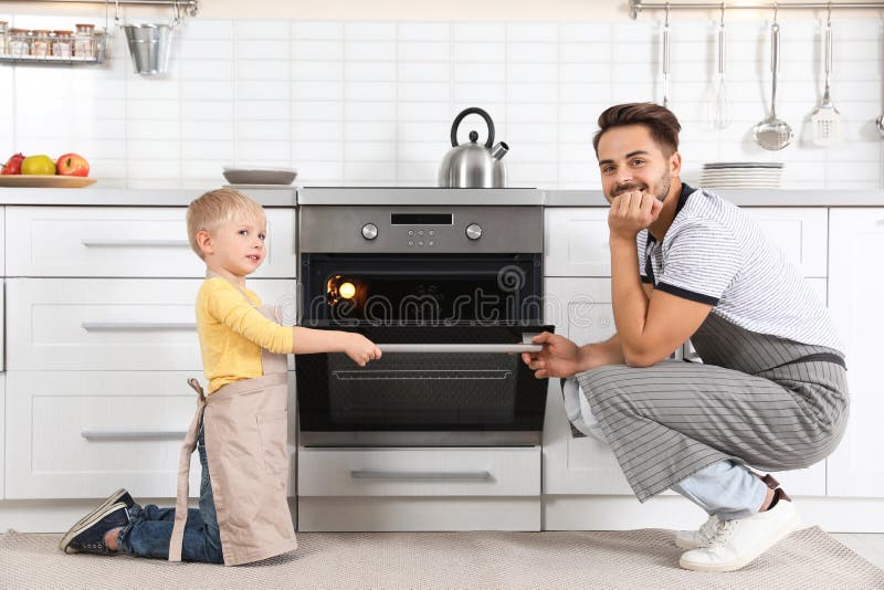 Young Man and His Son Baking Something Stock Photo - Image of inside ...