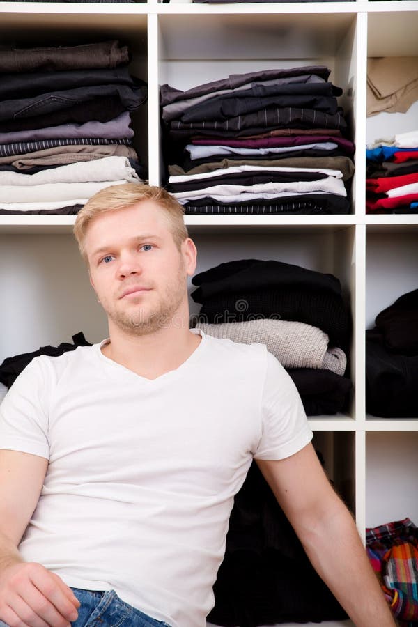 Young Man with His Wardrobe Stock Photo - Image of choice, caucasian ...