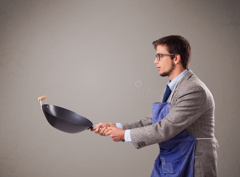 Young Man Holding Black Frying Pan Stock Photos - Free & Royalty-Free ...