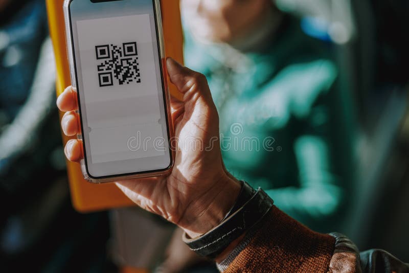 Young Man Holding Cellphone with QR Code on Display Stock Photo - Image ...
