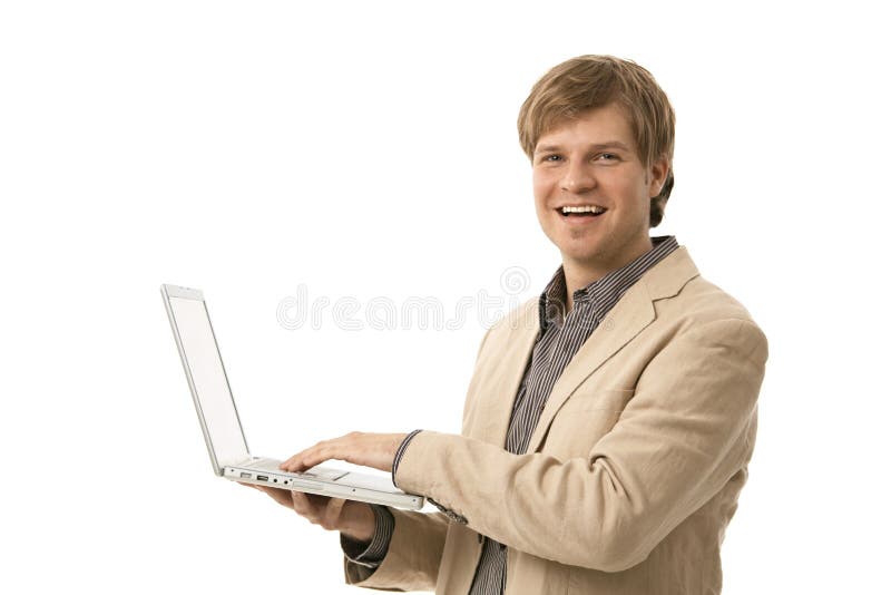 Young man holding computer stock photo. Image of alone - 17626928