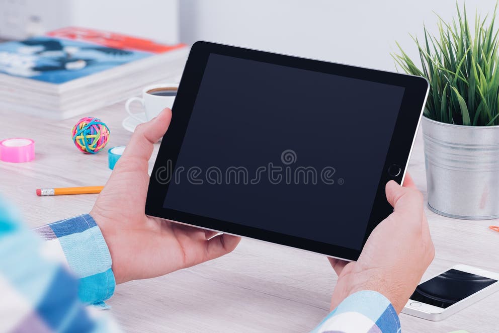 Young Man Holding Ipad Digital Tablet on Table Desk Stock Photo - Image ...