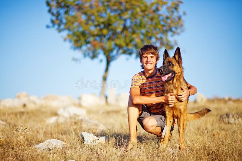 Young man holding a dog stock image. Image of love, young - 61117671