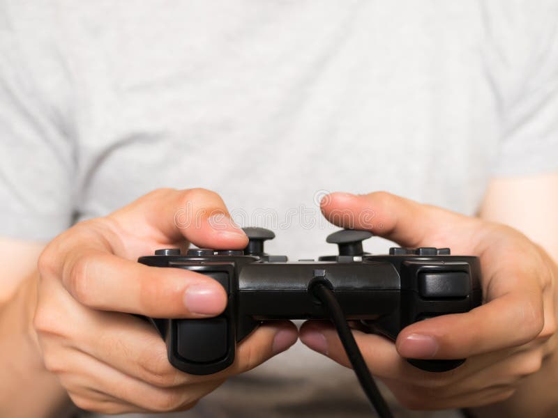 A Young Man Holding Game Controller Playing Video Games Stock Image ...