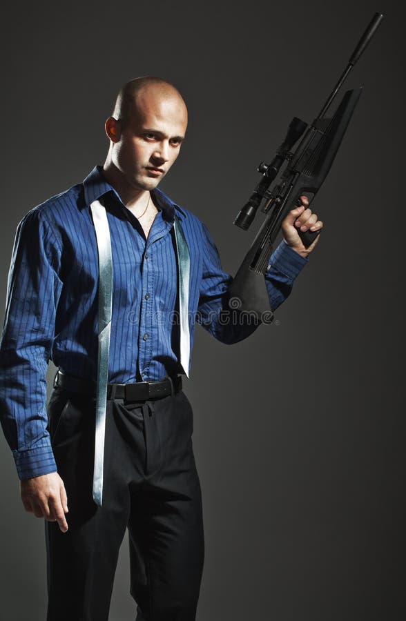 Young Man Holding A Gun. Stock Images - Image: 29032564