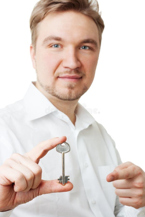 Young man with key stock photo. Image of adult, people - 27663512