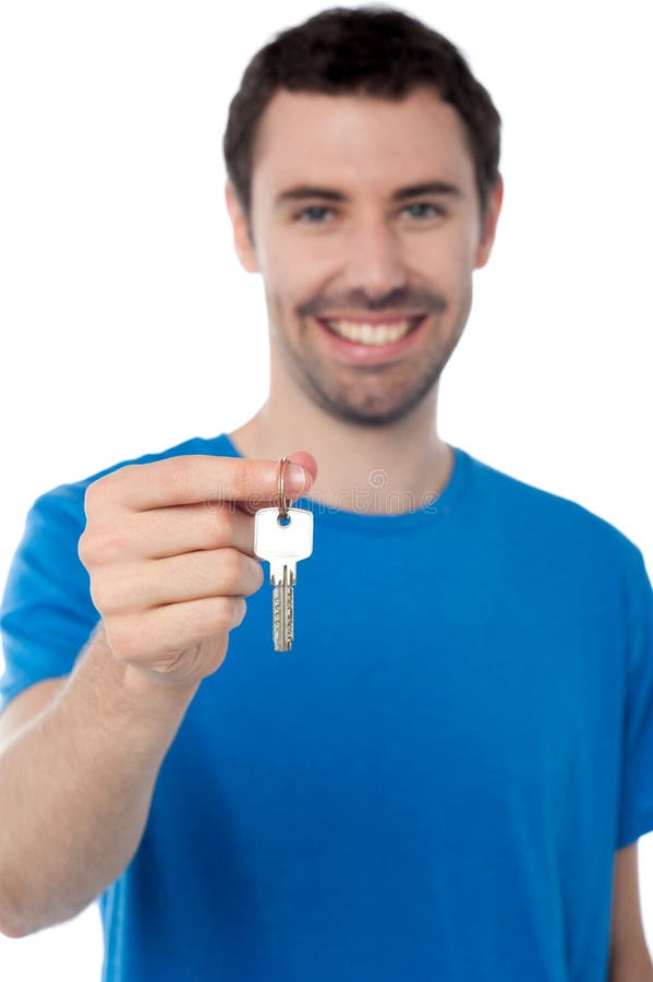 Young man in holding key stock photo. Image of holding - 45586868