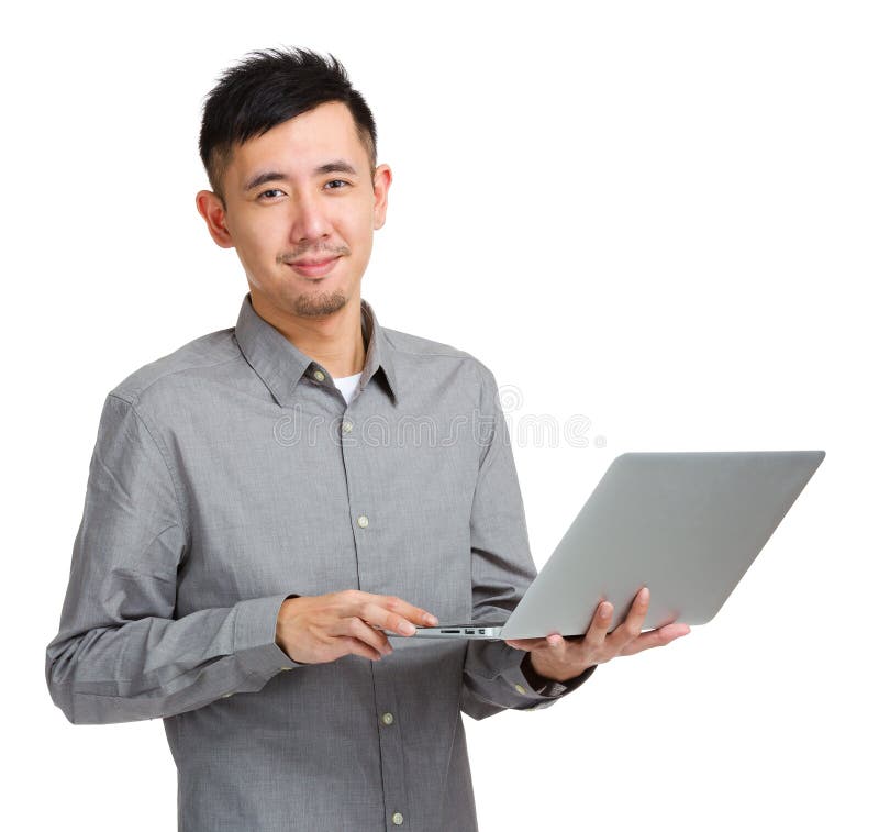 Young man holding laptop stock image. Image of malaysian - 40943393
