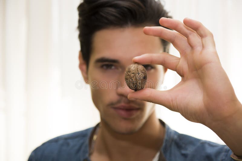 Young Man Holding a Large Delicious Nut Stock Image - Image of fruit ...